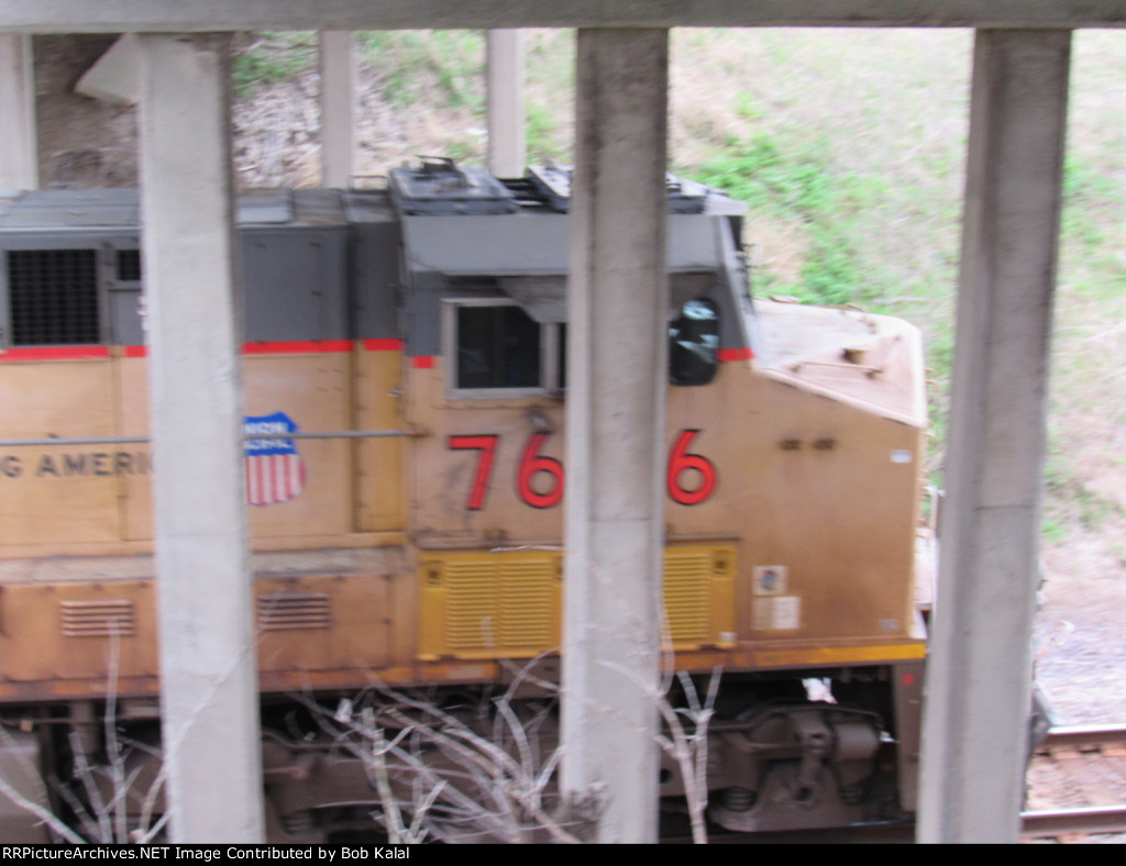 UP 8217 7293 Northbound under Cnty Rd 1000 Bridge with UP 7636 bqinging up the Rear